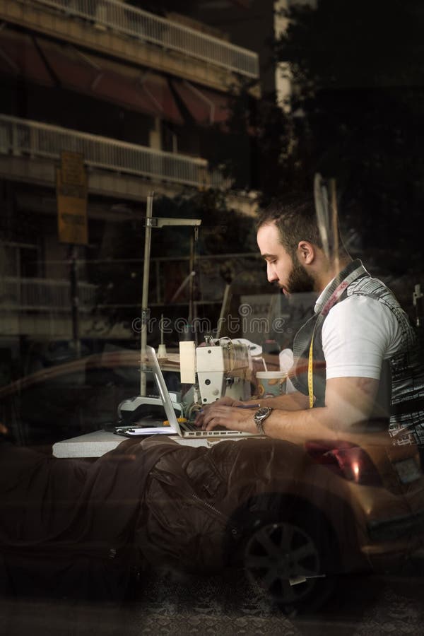 Man sewing stock photo. Image of muslim, dressmaker - 264446688