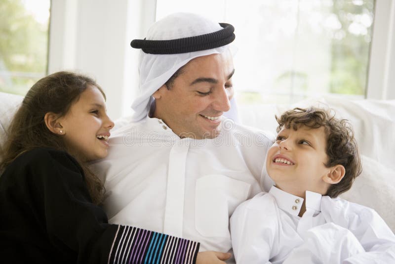 A Middle Eastern Family Reading a Book Together Stock Photo - Image of ...