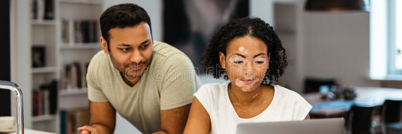 Middle Eastern Man and Woman Working with Laptop Together Stock Image ...