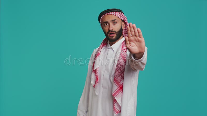 Middle Eastern Person Does Stop Sign Stock Video - Video of studio ... Middle Eastern Person Does Stop Sign Stock Video - Video of studio ...