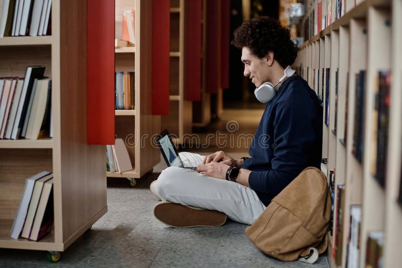 Middle Eastern Student Using Laptop in Library Stock Photo - Image of ...