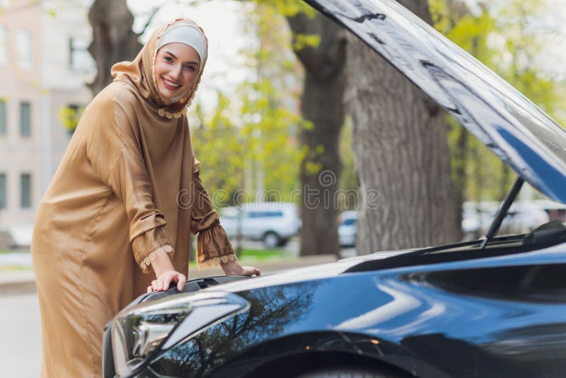 Middle Eastern Woman Driving a Car, Looking Forward. Stock Photo ...
