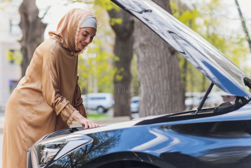 Middle Eastern Woman Driving a Car, Looking Forward. Stock Photo ...