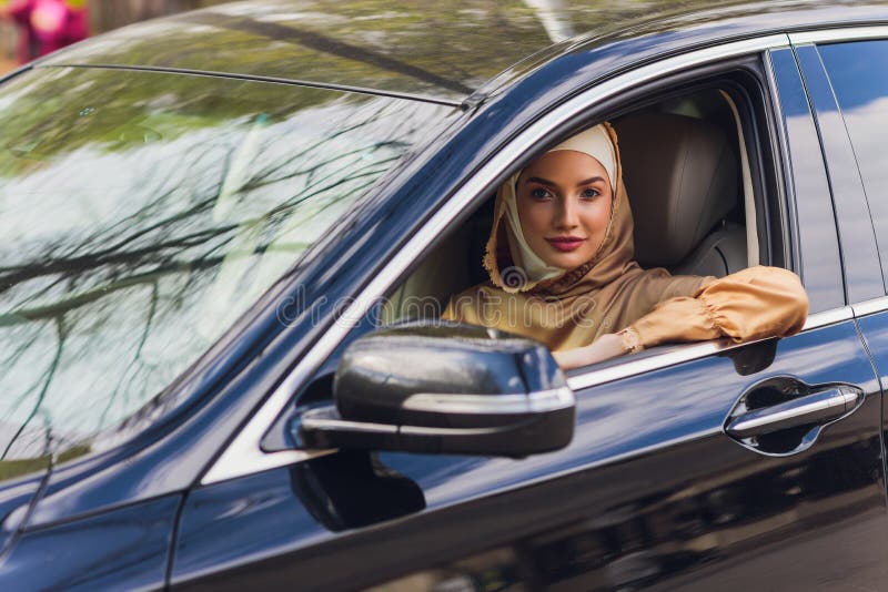 Middle Eastern Woman Driving a Car, Looking Forward. Stock Photo ...