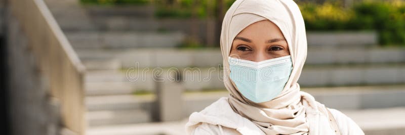 Middle Eastern Woman in Face Mask Standing while Working Out Stock ...