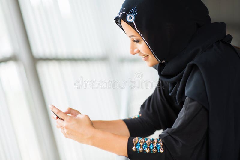 Smiling Arab Saudi Man Hand Using a Smart Phone Outdoor Stock Image ...