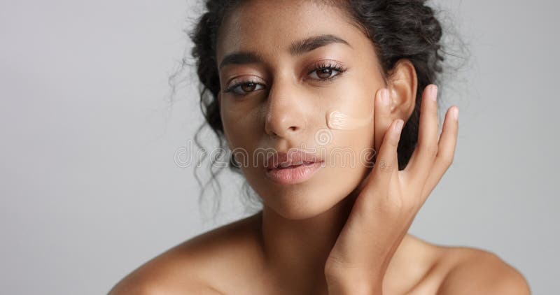 Middle Eastern Young Woman in Studio with a Foundation on Cheek Closeup ...