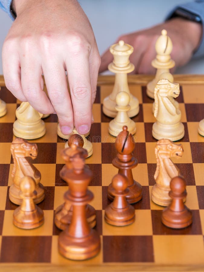 Middle Game - the Hand with Pawn Makes a Move on Chess Board Stock ...