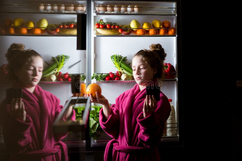 Midnight Snack, Looking into Fridge Stock Photo - Image of looking ...
