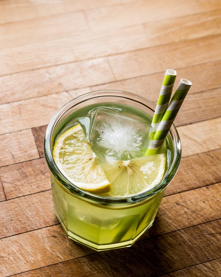 Midori Sour Cocktail with Ice and Lemon. Stock Photo - Image of elegant ...