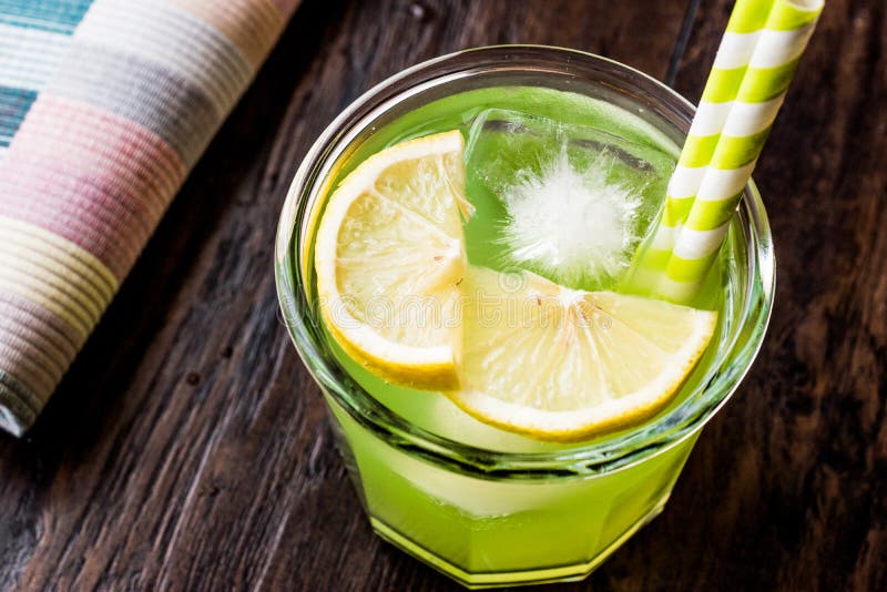 Midori Sour Cocktail with Ice and Lemon. Stock Photo - Image of drink ...