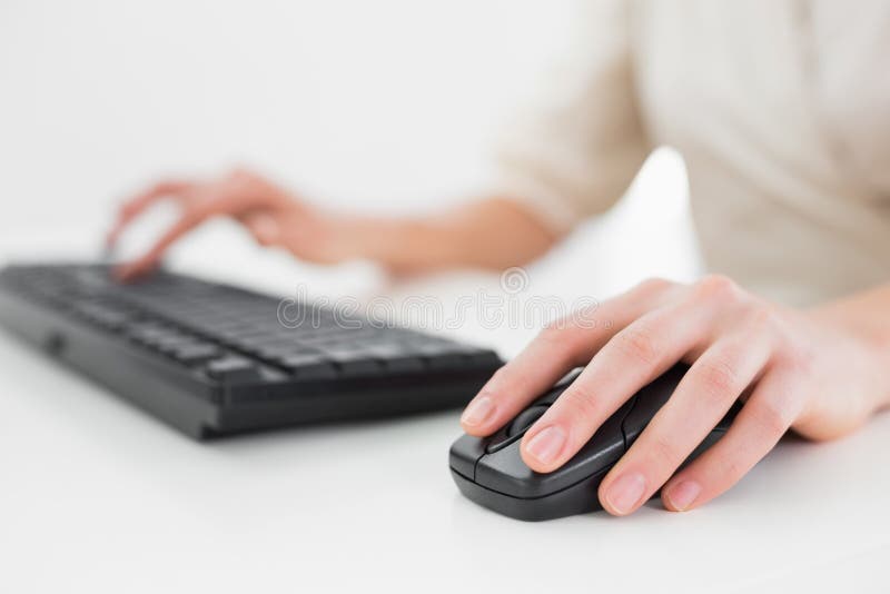 Cropped Image of Businesswoman Using Mouse on Desk at Office Stock ...