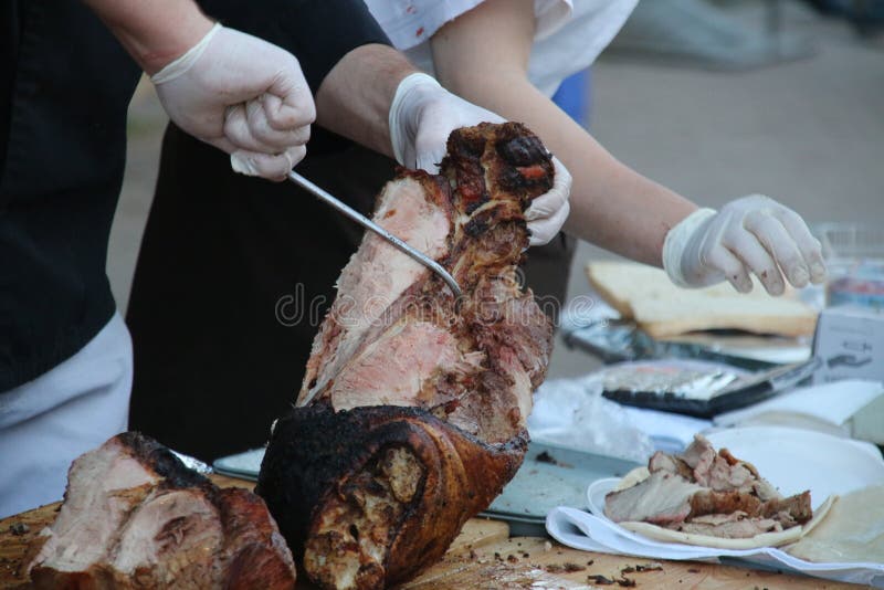 Midsection of Butcher`s Hands Cutting Meat with Knife Stock Image ...