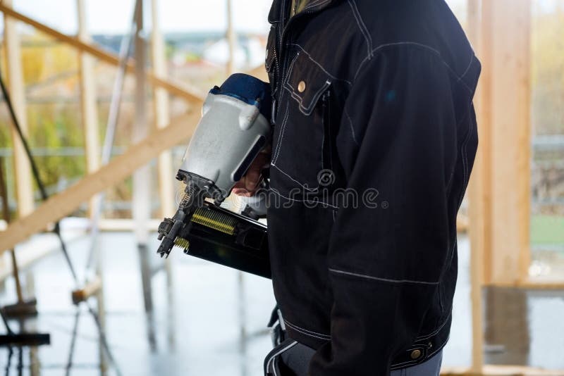 Midsection of Carpenter Holding Drill Machine at Site Stock Image ...