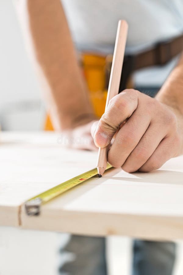 Midsection of Carpenter Marking Table with Measure Tape Stock Image ...