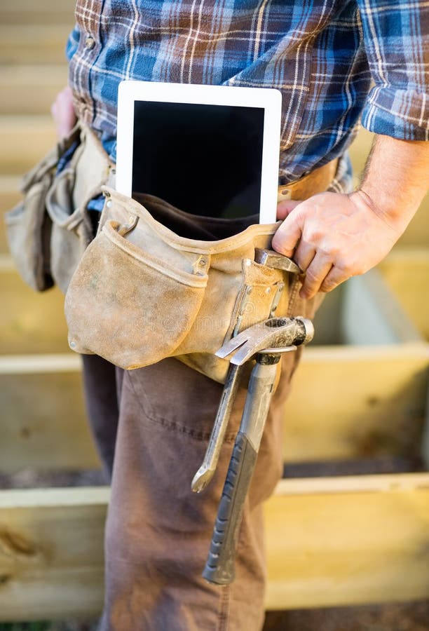 Midsection of Carpenter with Tablet Computer and Stock Image - Image of ...