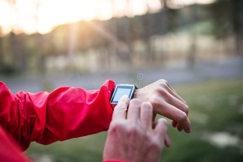 A Midsection of Female Runner Outdoors in Autumn Nature, Checking the ...
