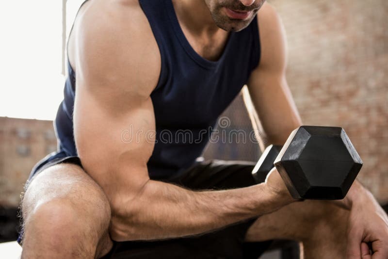 Midsection of a Man Lifting Dumbbell Stock Photo - Image of ...