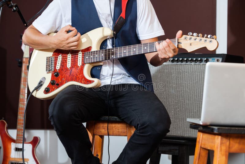 Male Performer Playing Electric Guitar Stock Photo - Image of people ...