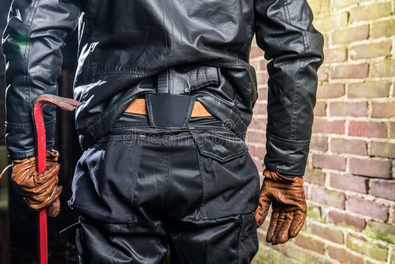 Midsection Rear View of Gangster with Crowbar and Gun Standing B Stock ...