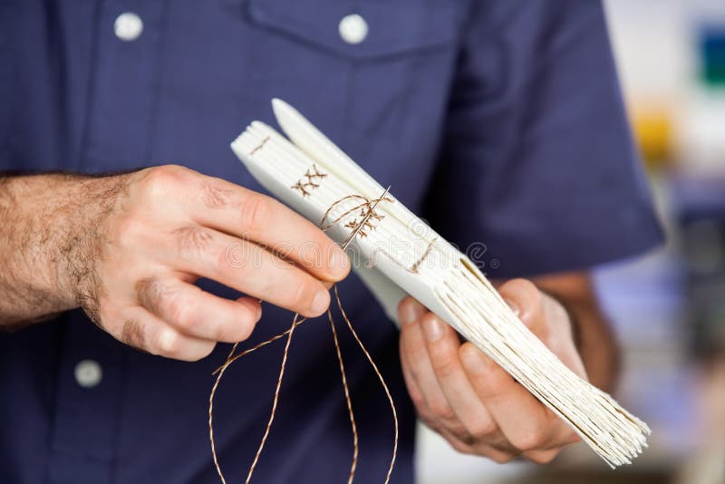 Midsection of Worker Binding Pages Stock Photo - Image of cropped ...