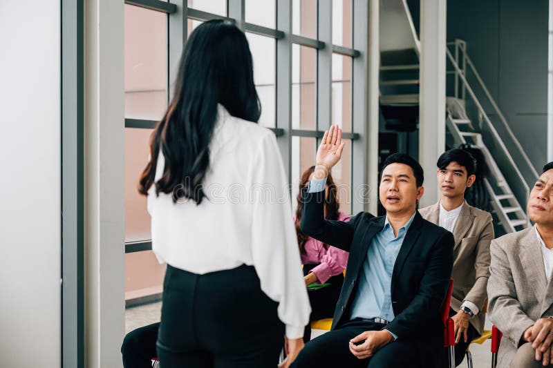 In the Midst of a Conference, a Young Man Eagerly Raises His Hand To ...