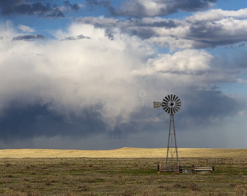 A Lone Windmill on a Stormy Afternoon Stock Photo - Image of rain ...