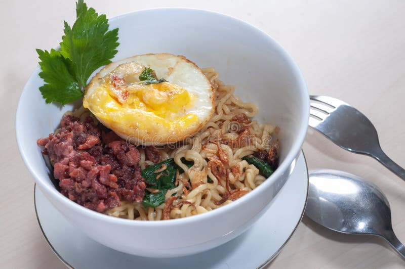 Mie Instant Telor Kornet or Instant Noodle Served with Fried Egg and ...