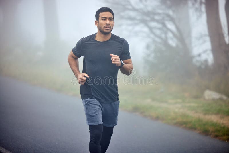 A Mighty Warrior Has Appeared from the Mist. a Sporty Young Man Running ...