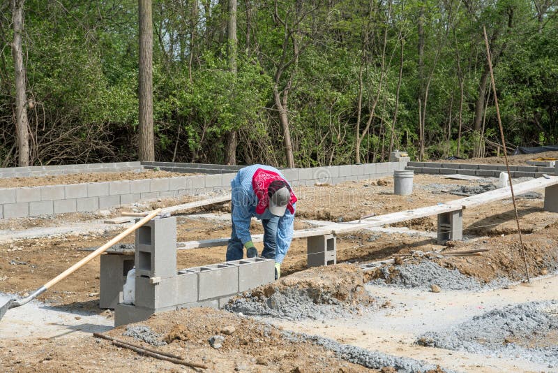 Migrant Worker Laying Cement Block Building Foundation Stock Photo ...