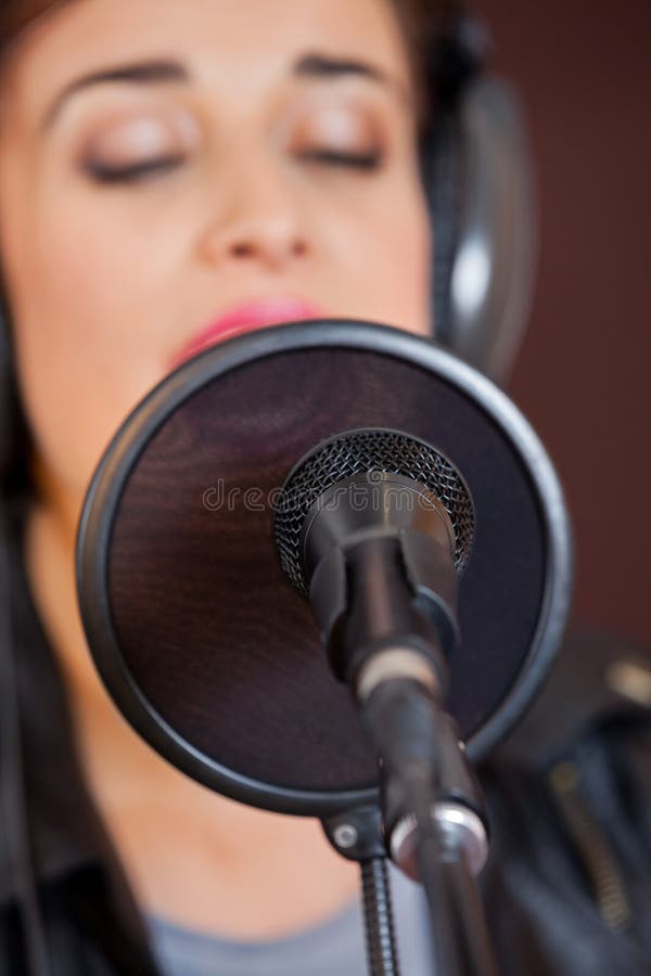 Mike and Condenser with Woman Singing in Studio Stock Photo - Image of ...