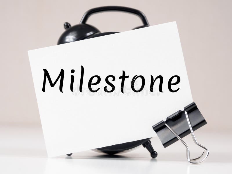 Milestone Text Meaning on White Note Paper Background Alarm Clock Stock ...