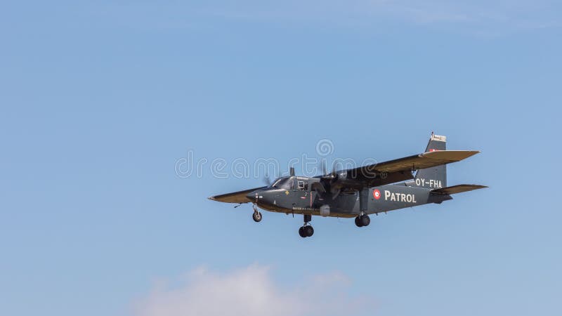 Military Airplane with a Spinning Propeller Soaring through a Bright ...