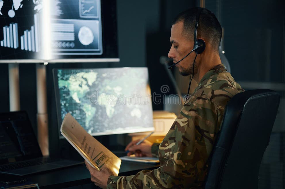 Military Analyst Evaluating Data on Multiple Screens Stock Photo ...