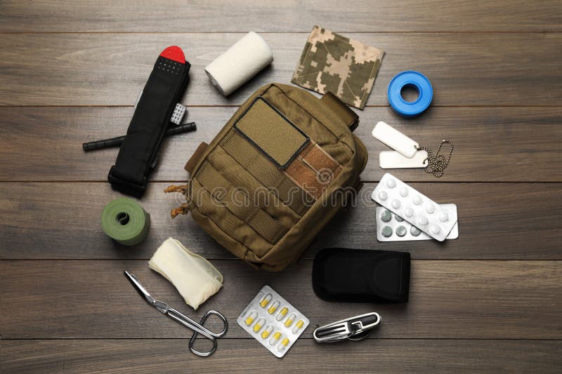 Military First Aid Kit on Wooden Table, Flat Lay Stock Image - Image of ...