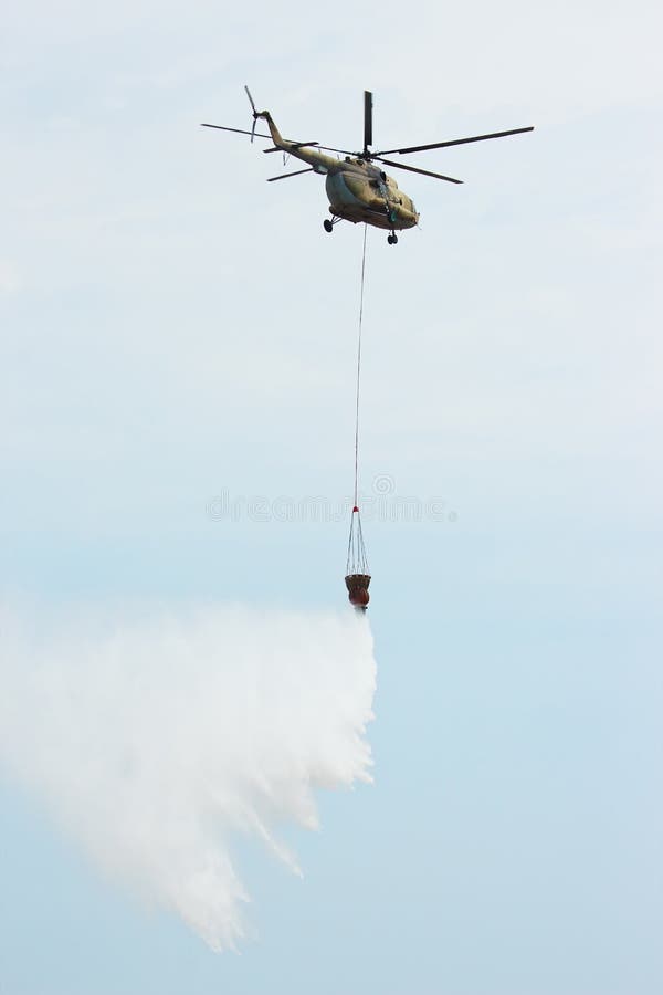 Military Helicopter MI-8 Extinguishes the Fire Stock Photo - Image of ...