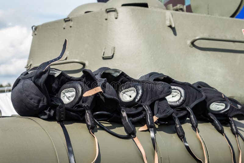 Military Helmets of the Tank Crew Lie on the Tank`s Armor Stock Photo ...