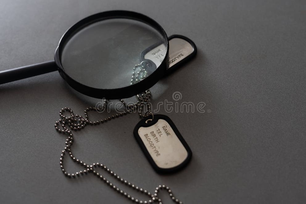 Military ID Tags Magnifying Glass Stock Image - Image of dangle, label ...