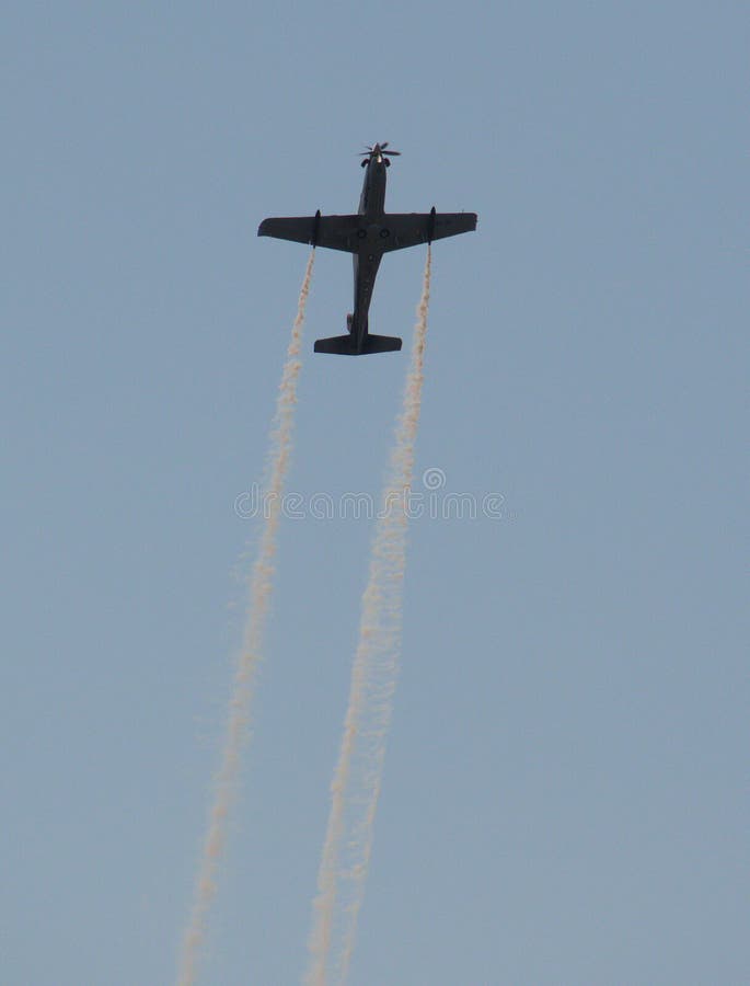 Military Jet Flying with Dual Smoke Trails in the Sky Stock Photo ...