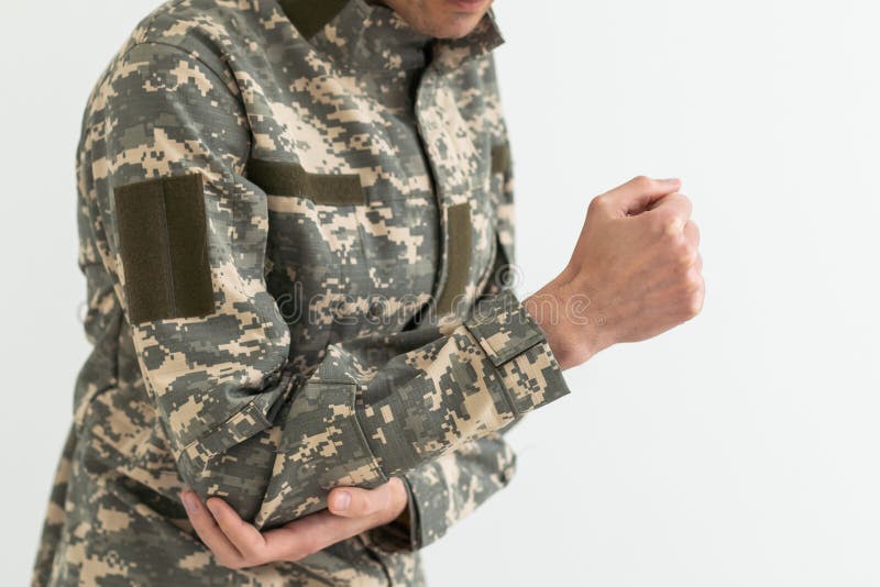 A Military Man Has a Pain in His Arm. Stock Photo - Image of clinic ...