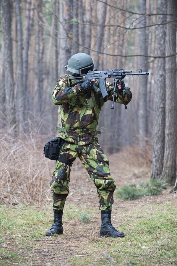 Military Man Shooting a Rifle in the Forest Stock Image - Image of ...