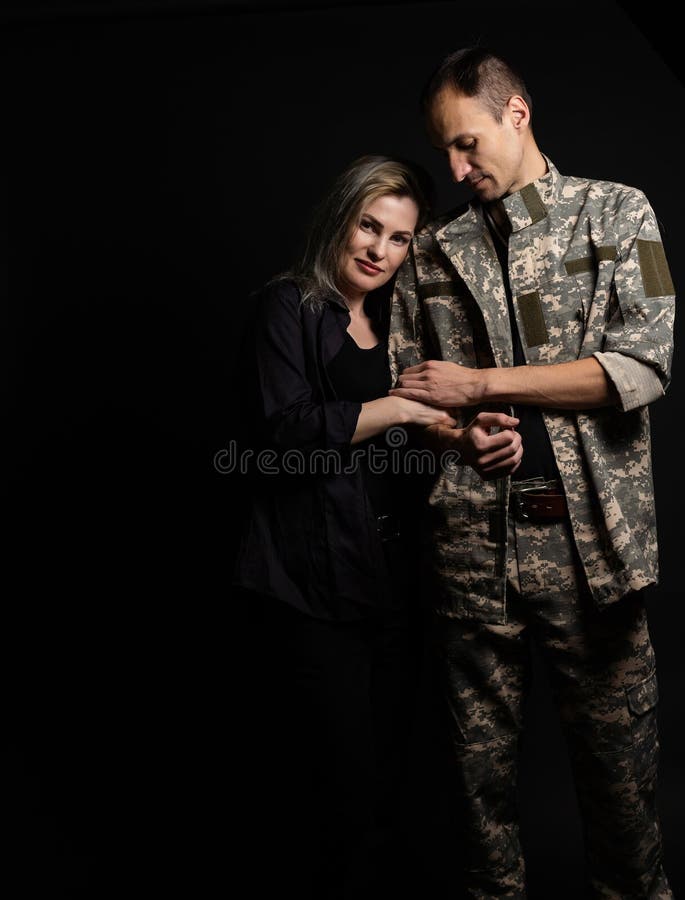 Military Man and His Wife on a Black Background Stock Photo - Image of ...
