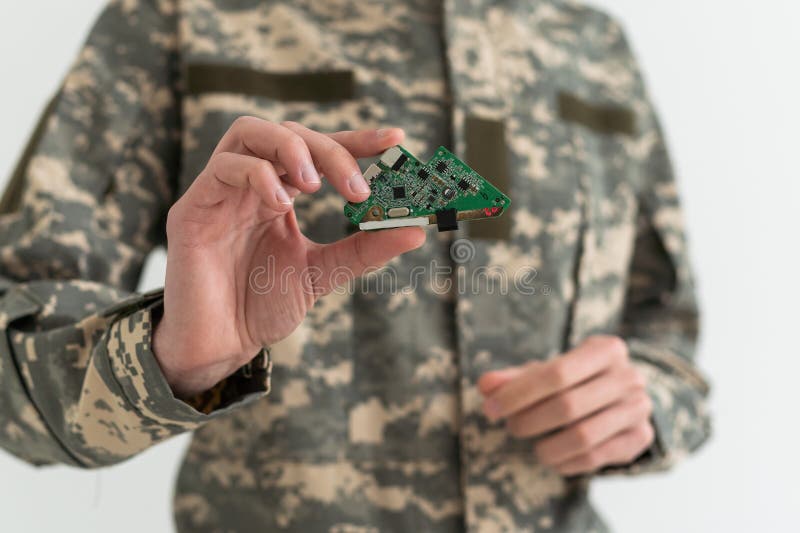 A Military Man is Holding a Chip Electronic Components. Microcircuits ...