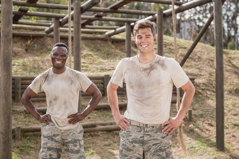 Military Man Standing with Hand on Hip during Obstacle Course in Boot ...