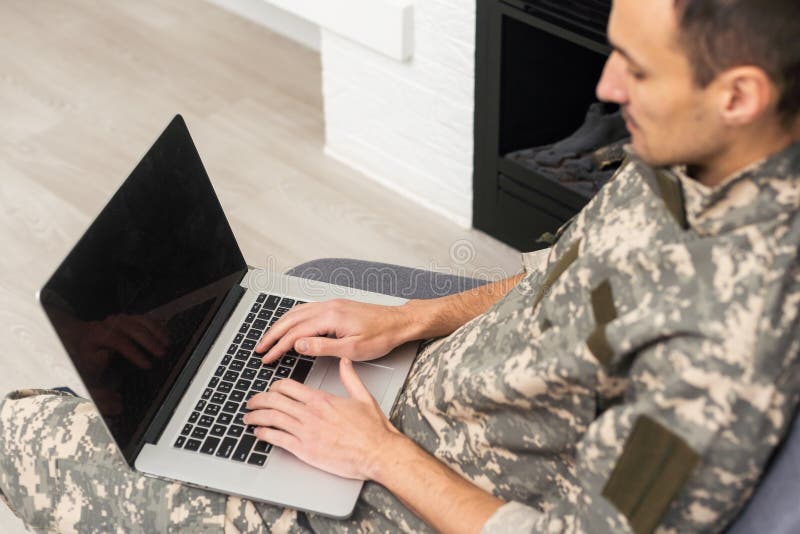 Military Man in Uniform Looking at Laptop Stock Photo - Image of coffee ...