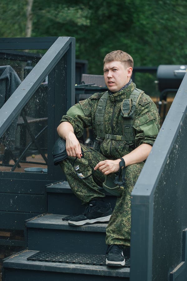 Military Men with Automatic Weapons Getting Ready To Play Airsoft ...
