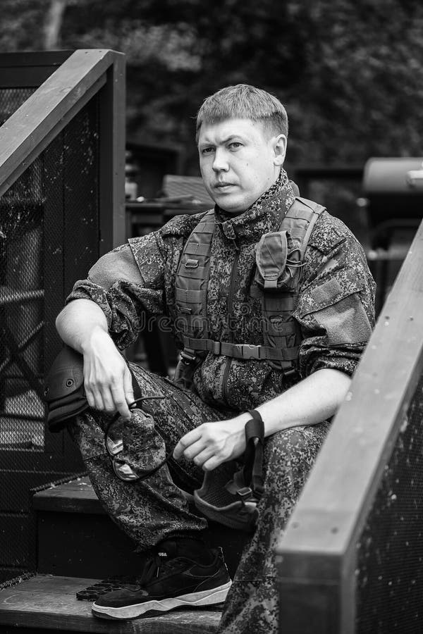 Military Men with Automatic Weapons Getting Ready To Play Airsoft ...