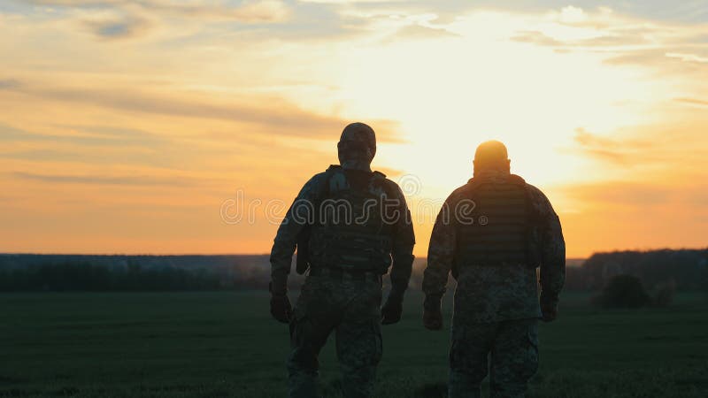 Military Men Returning after Completing a Task. Soldiers in Military ...