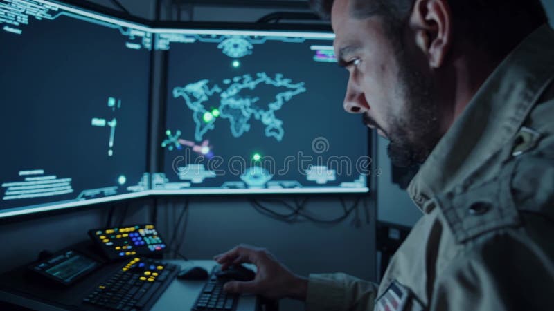 Military Officer Monitoring Global Operations on Computer Screens Stock ...