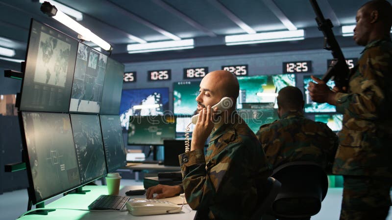 Military Officer Receiving Telephone Call while Looking at Intel Files ...